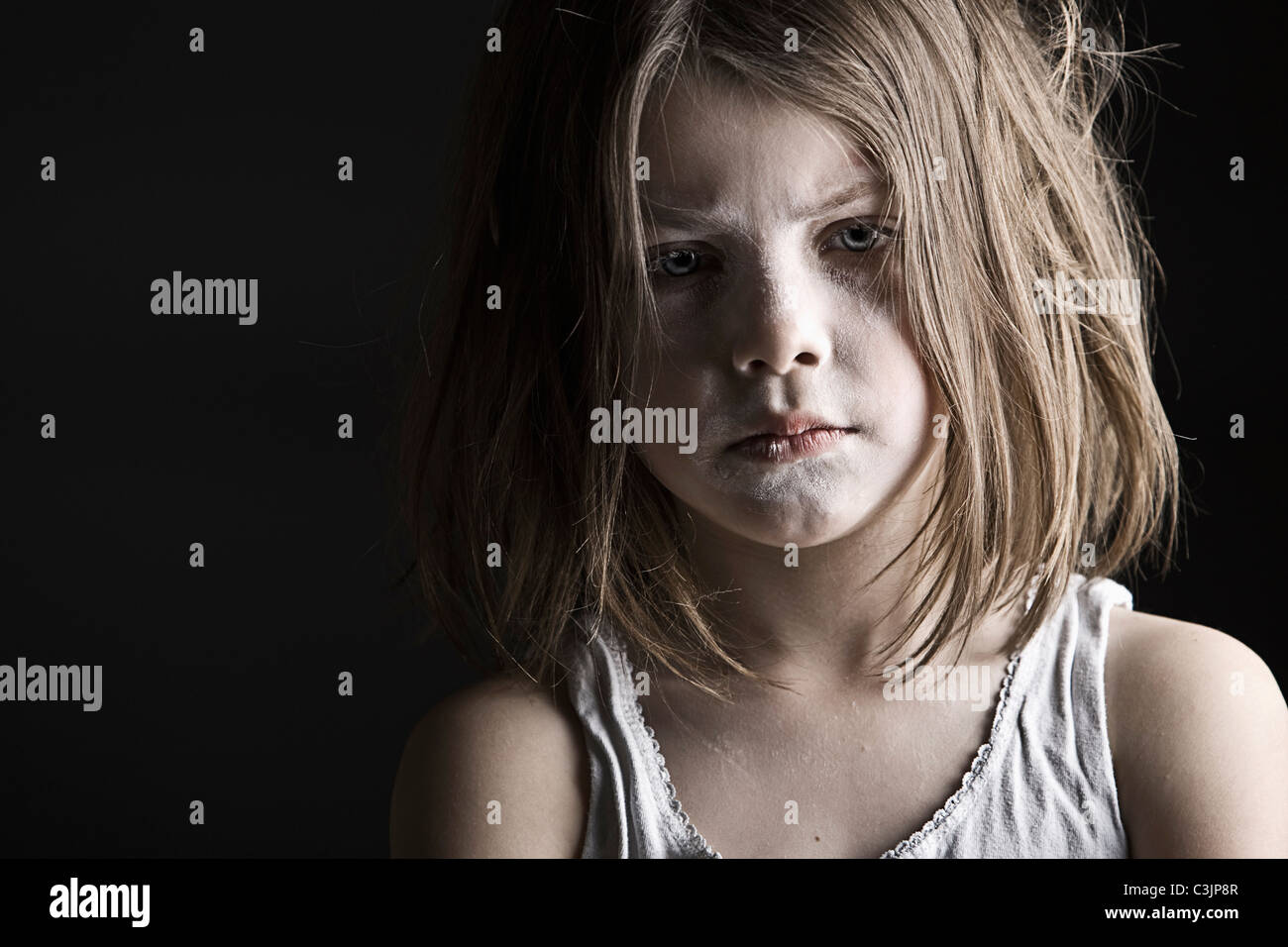 Studio portrait of sad girl (6-7 Stock Photo - Alamy