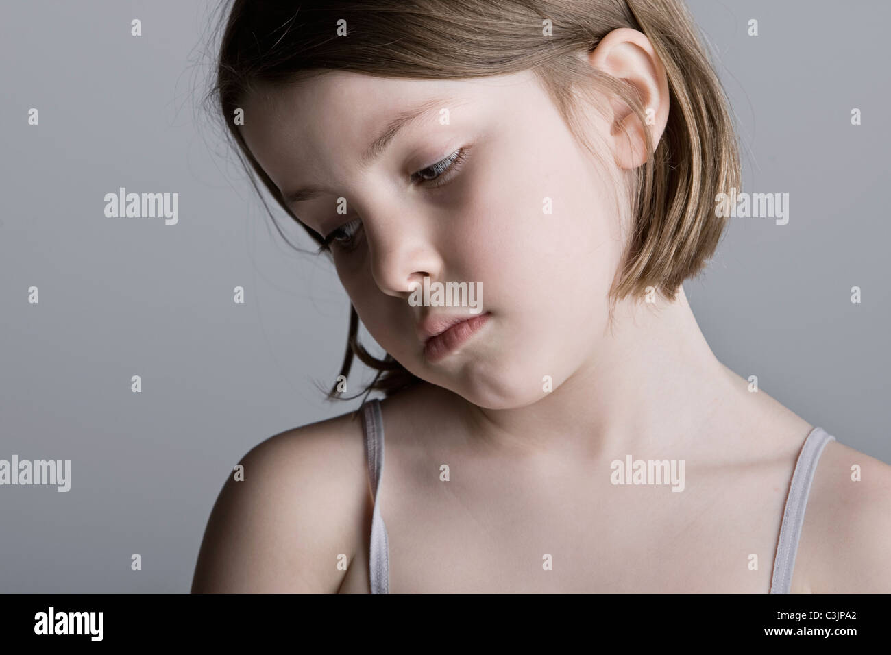 Studio portrait of sad girl (6-7 Stock Photo - Alamy