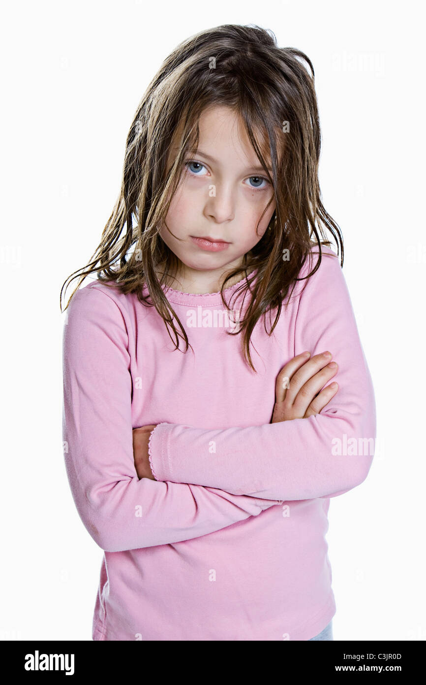 Studio portrait of sad girl (8-9 Stock Photo - Alamy