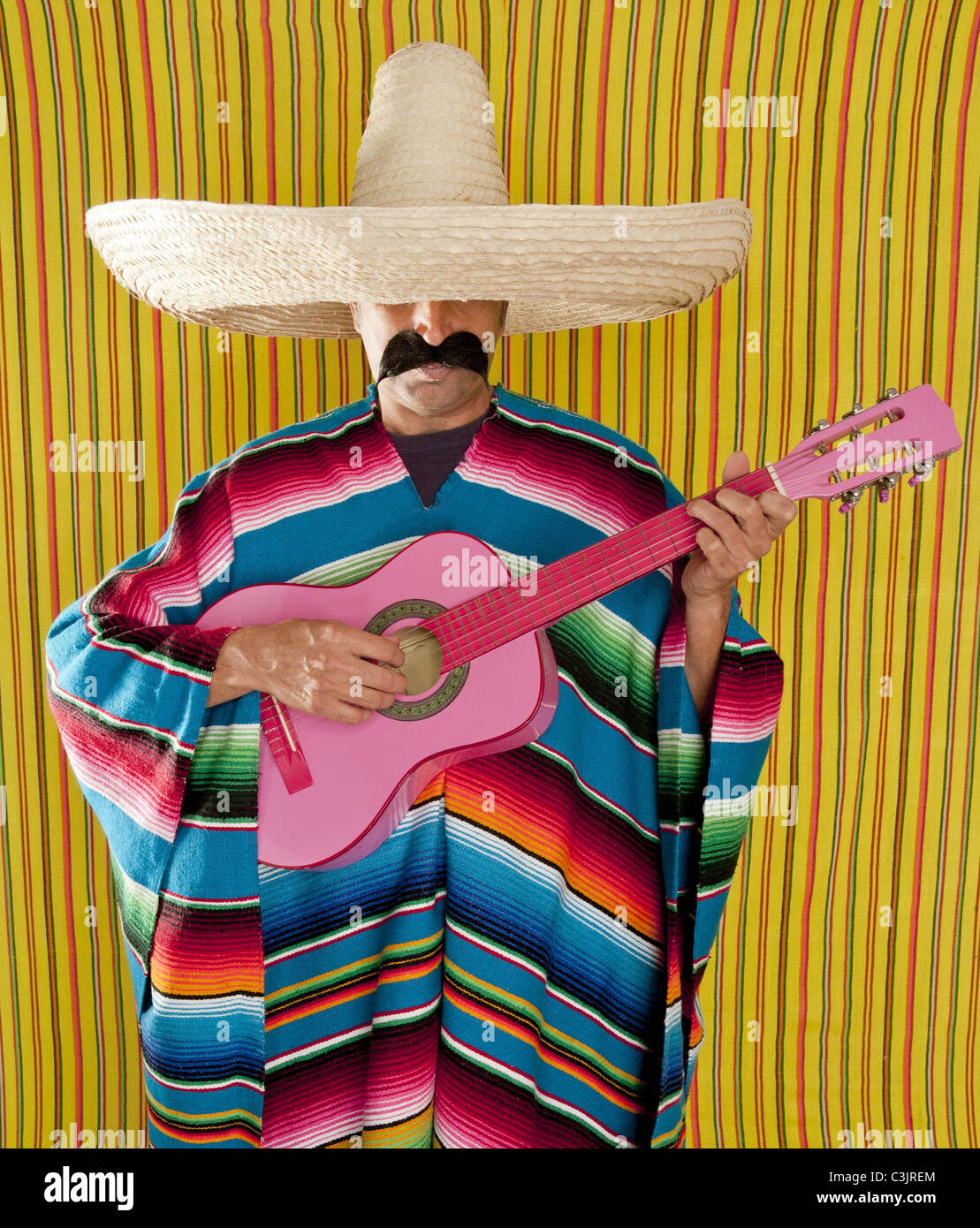 Mexican man serape poncho sombrero playing guitar typical Mexico Stock ...