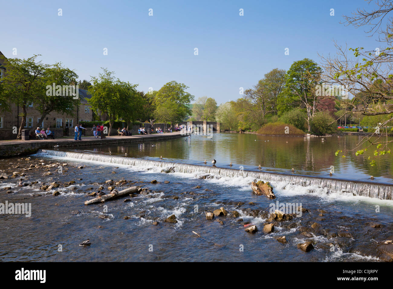 small weir on the River Wye flowing through Bakewell Derbyshire Peak ...