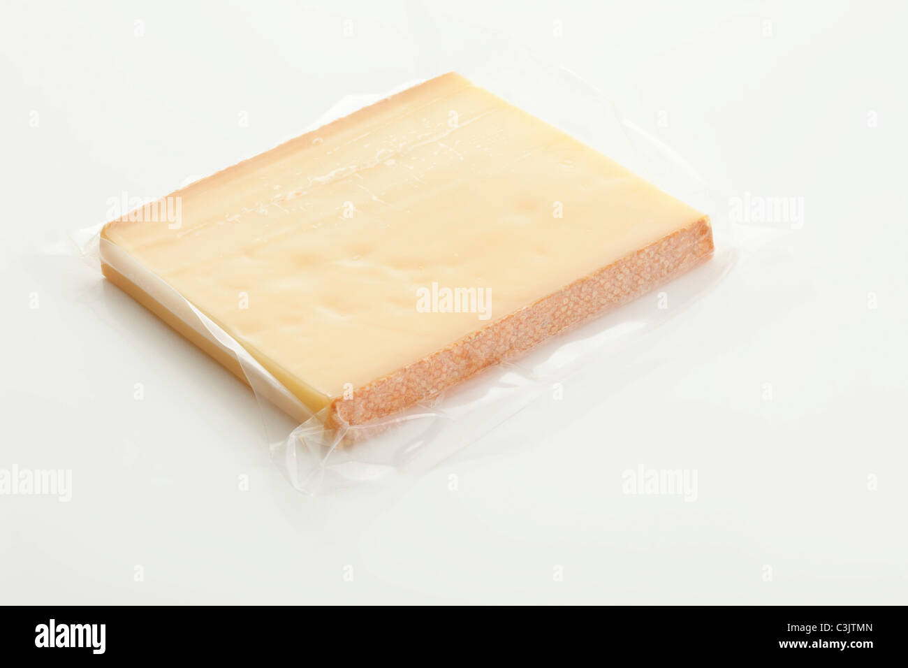 Wrapped cheese on white background Stock Photo - Alamy