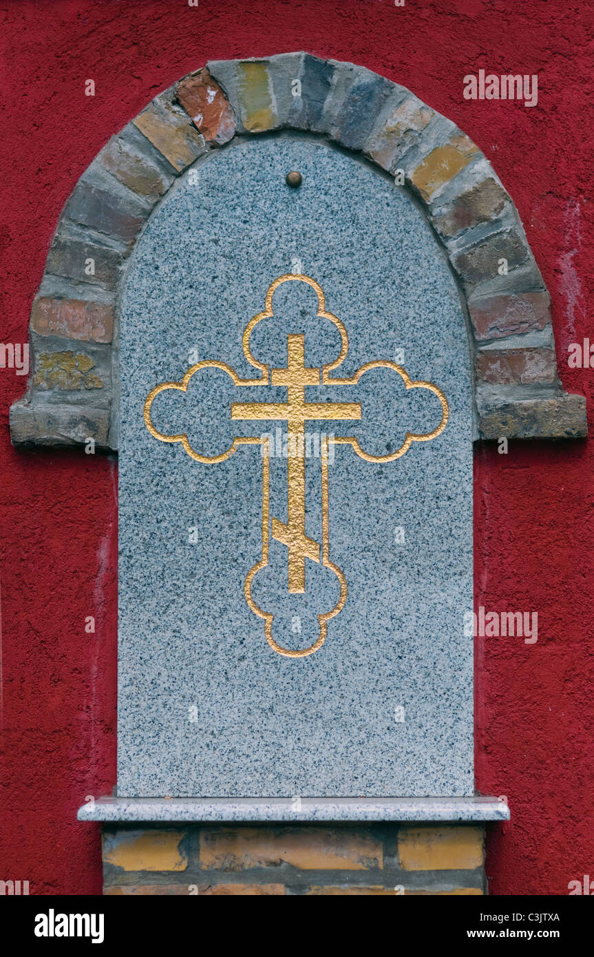 Cross sign on the church wall Stock Photo - Alamy