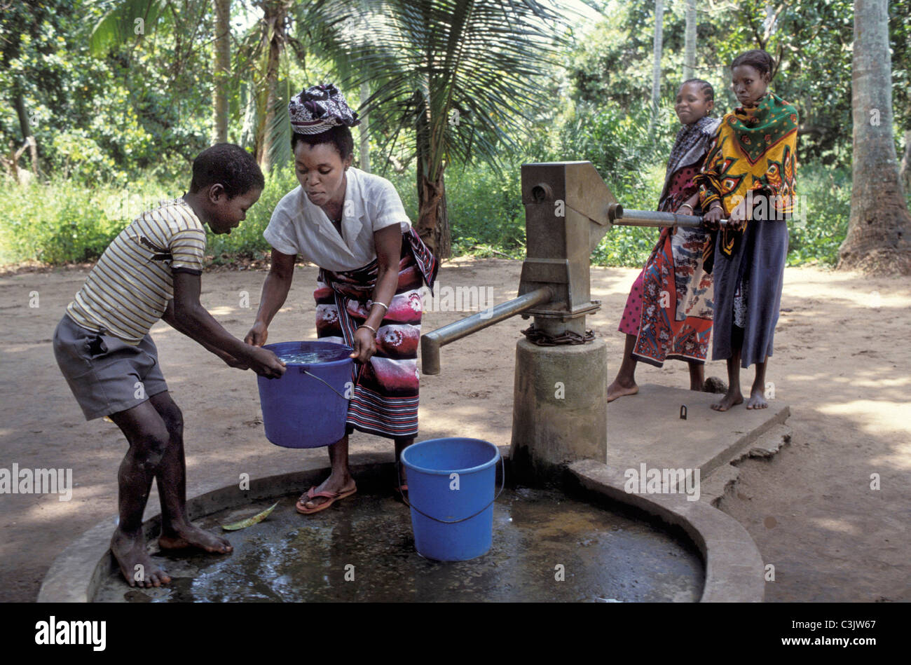 Fetching water in Kwale Kenya Stock Photo - Alamy