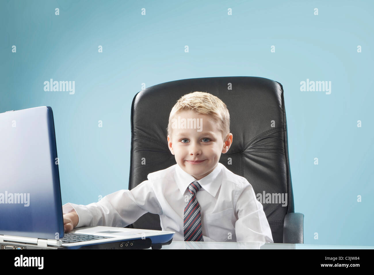 Boy using laptop, portrait Stock Photo - Alamy