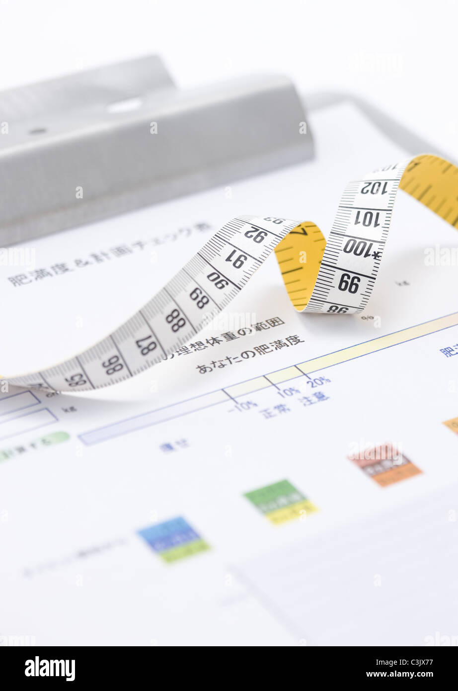 Tape measure and degree of obesity tracker Stock Photo - Alamy