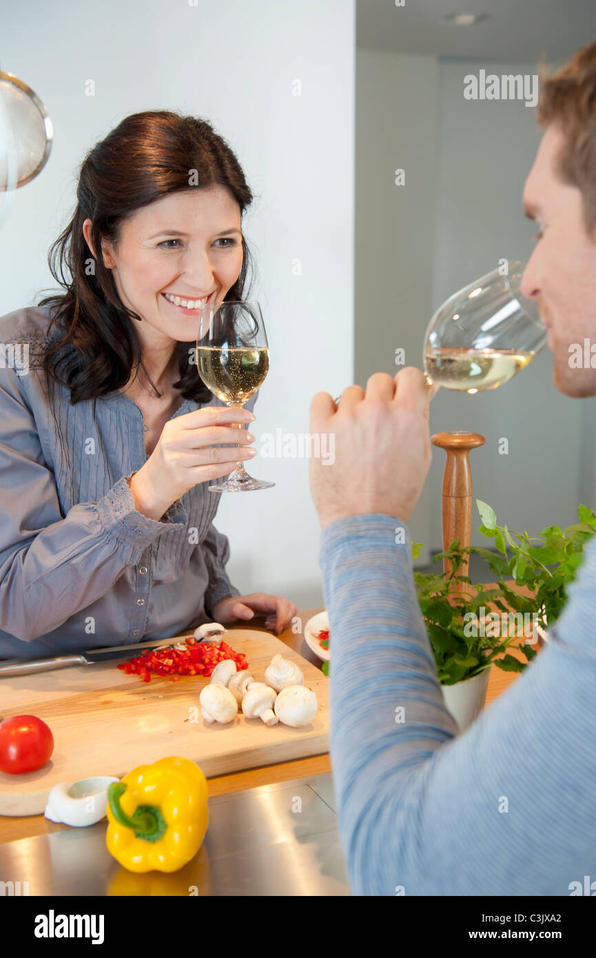 Germany, Munich, Man and woman cooking in kitchen Stock Photo - Alamy