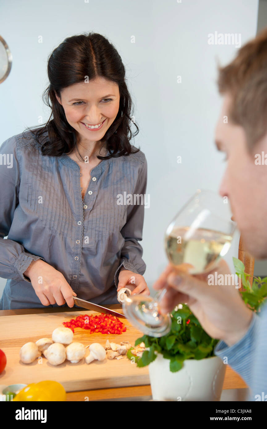 Germany, Munich, Man and woman cooking in kitchen Stock Photo - Alamy