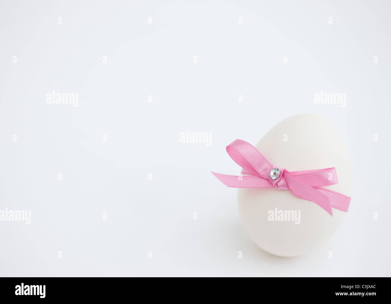 Egg tied with ribbon Stock Photo - Alamy