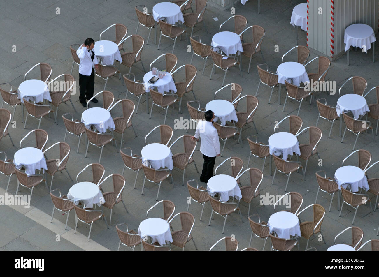 Waiters at empty cafe Stock Photo - Alamy