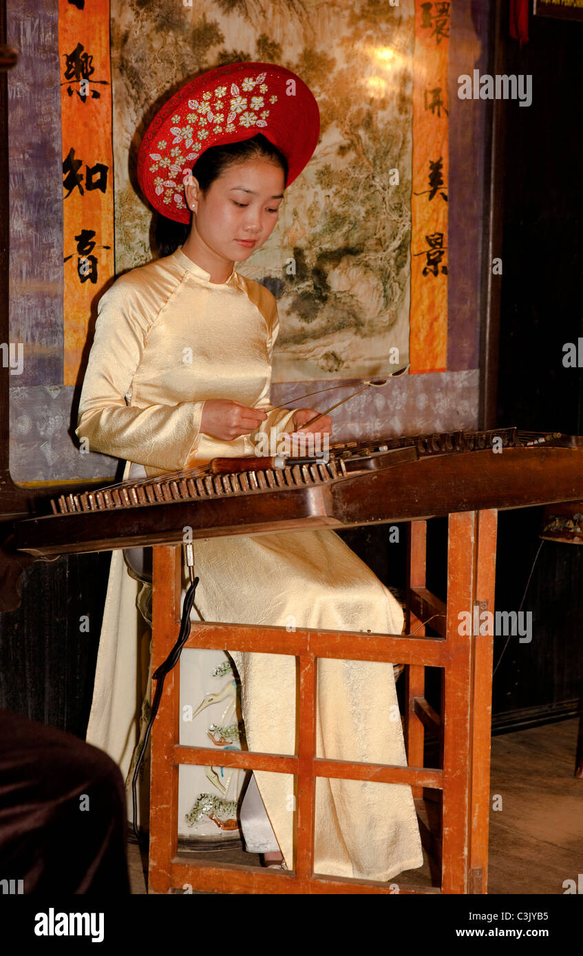 Young Lady playing traditional xylophone, Hoi An, Vietnam Stock Photo ...