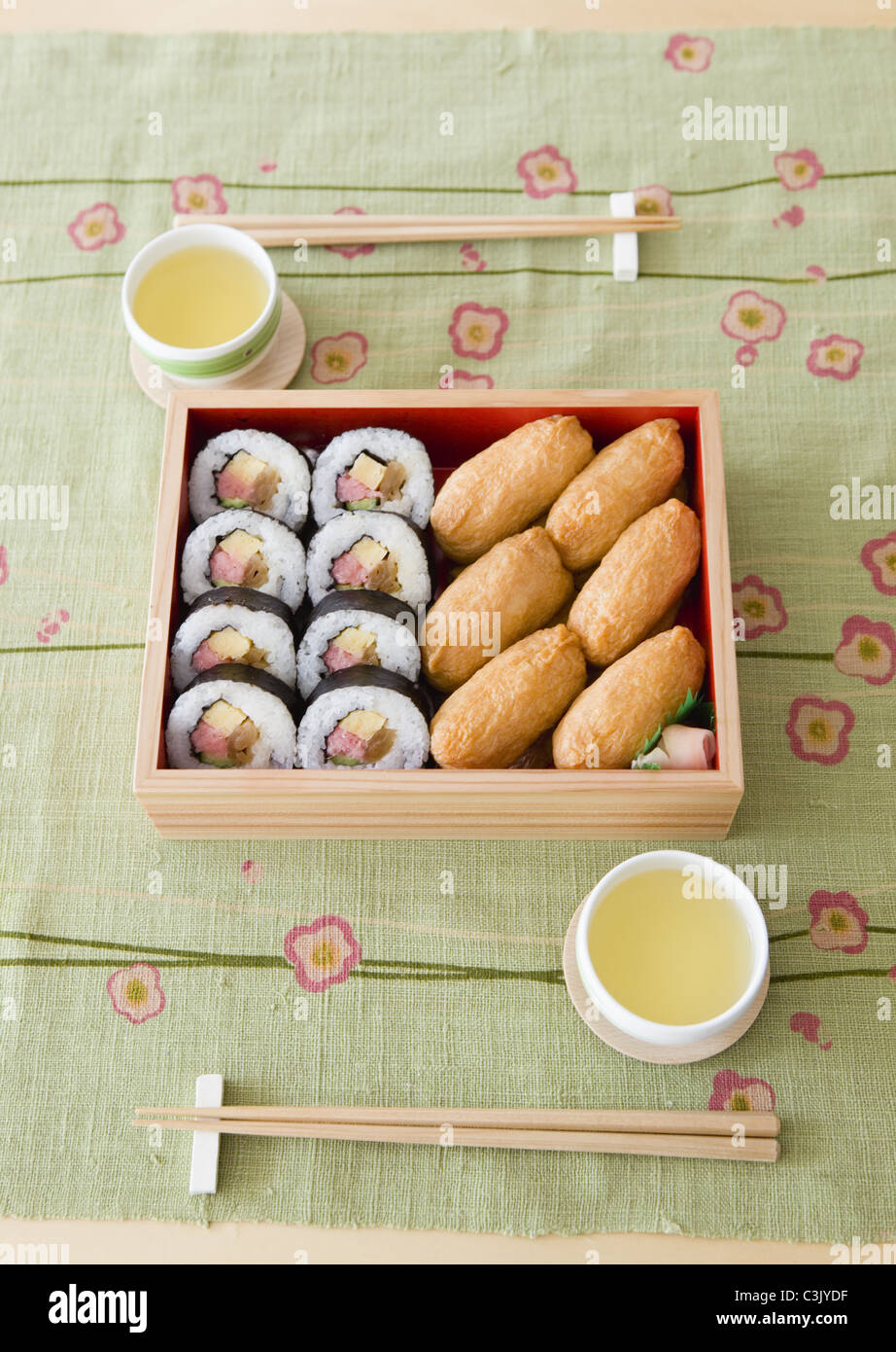 Sushi roll and inari sushi boxed lunch Stock Photo - Alamy