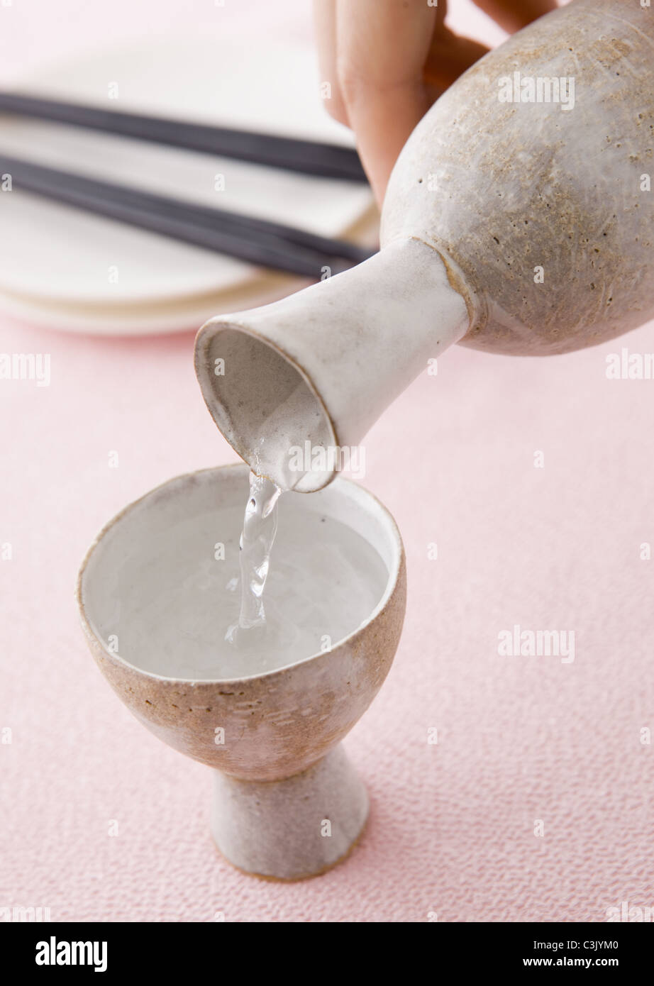 Pouring Japanese sake Stock Photo - Alamy