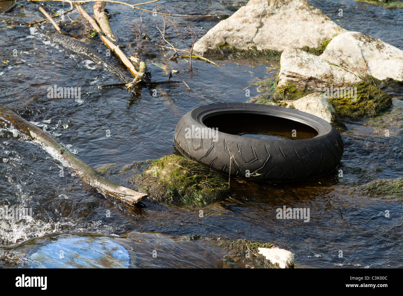 Rubbish left and Abandoned in a river Stock Photo - Alamy