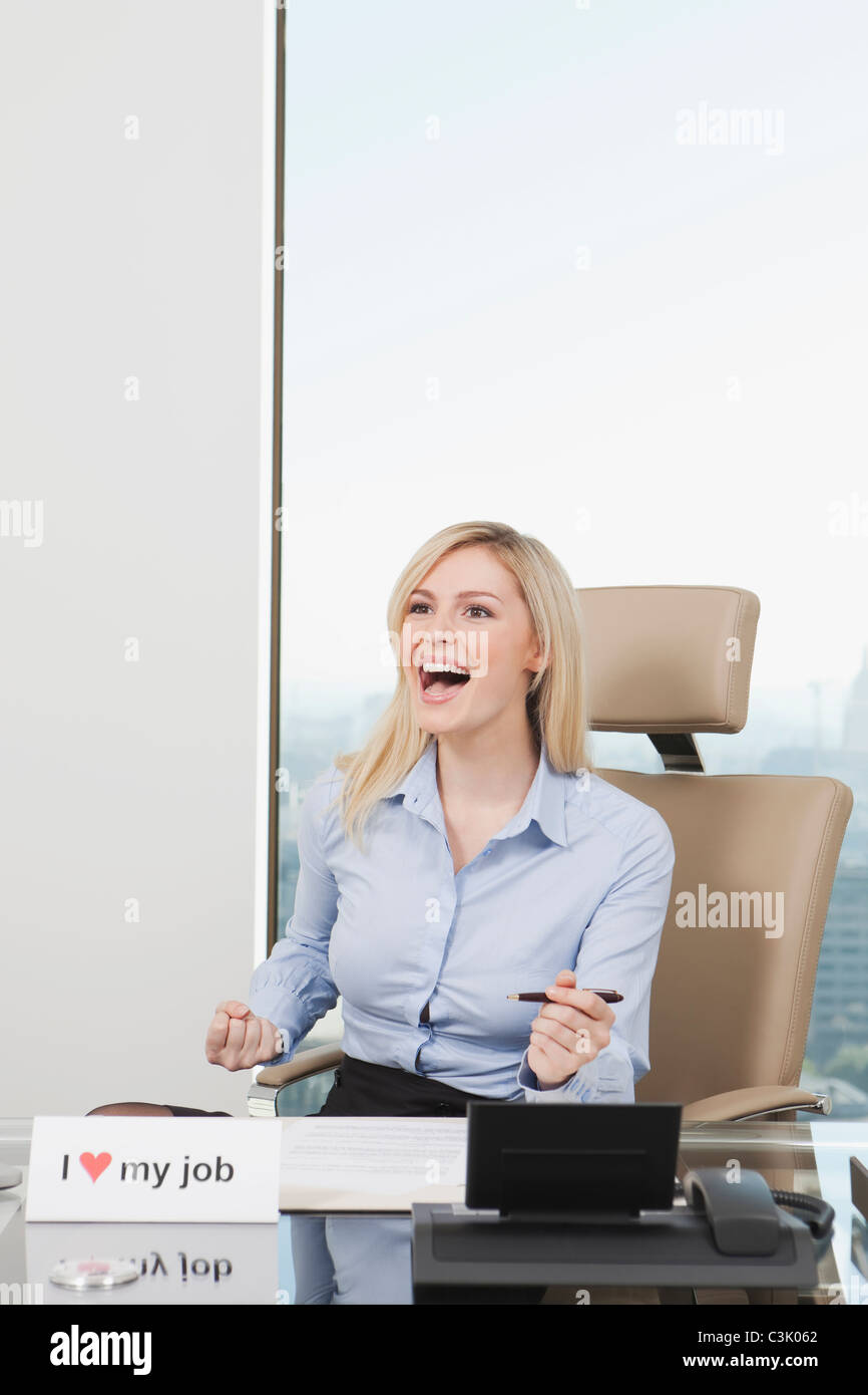 Germany, Frankfurt, Business woman laughing in office Stock Photo - Alamy