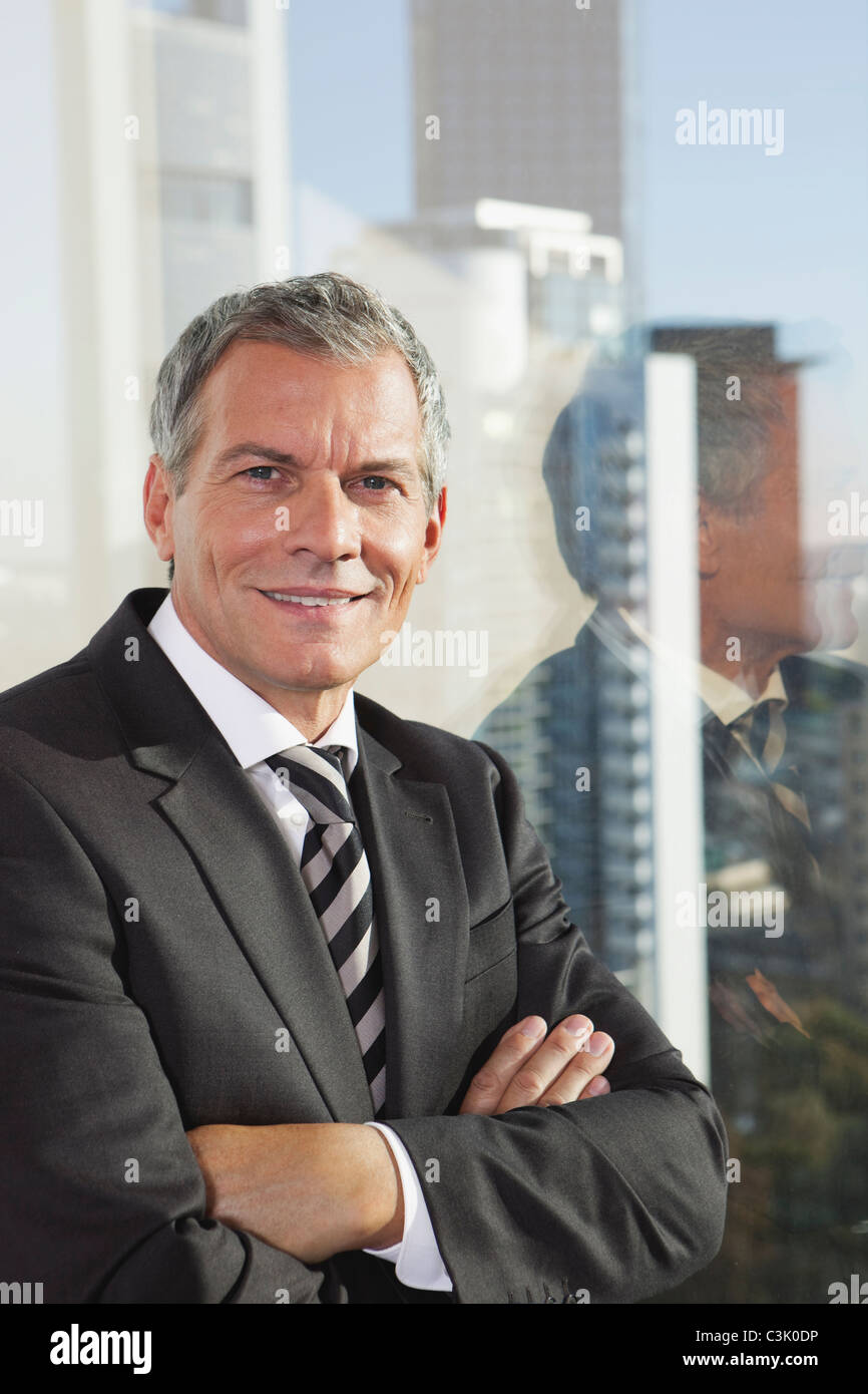 Germany, Frankfurt, Businessman in office, smiling, portrait Stock ...