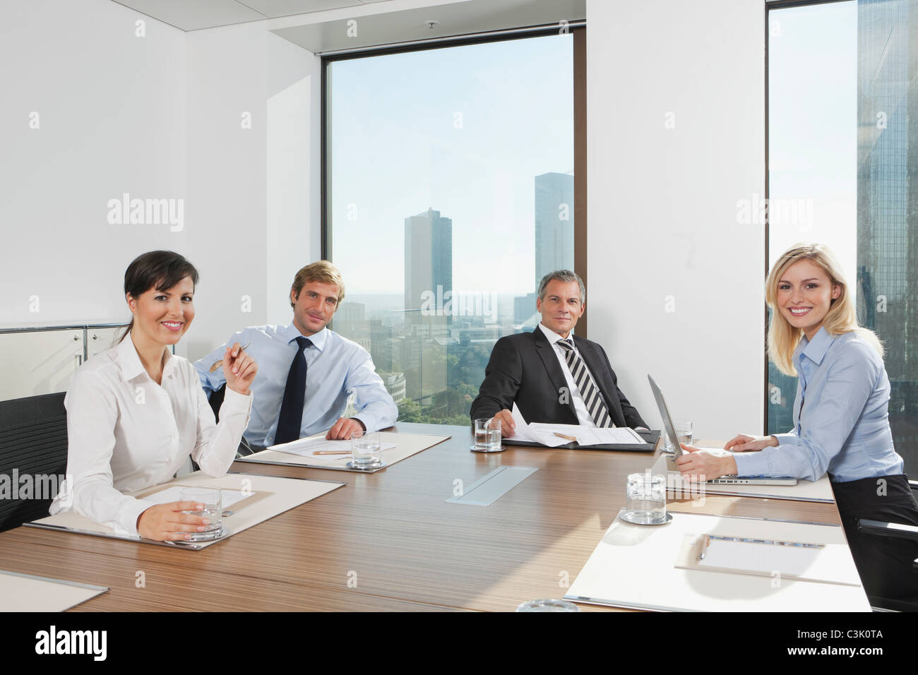 Germany, Frankfurt, Business people in conference room, smiling ...
