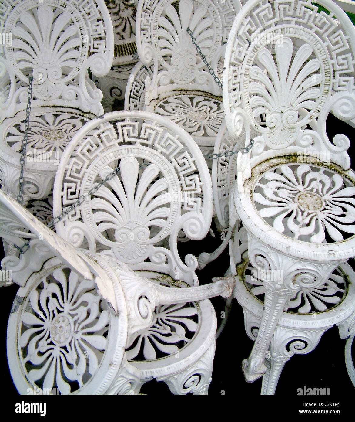 Metal garden chairs chained together Stock Photo - Alamy
