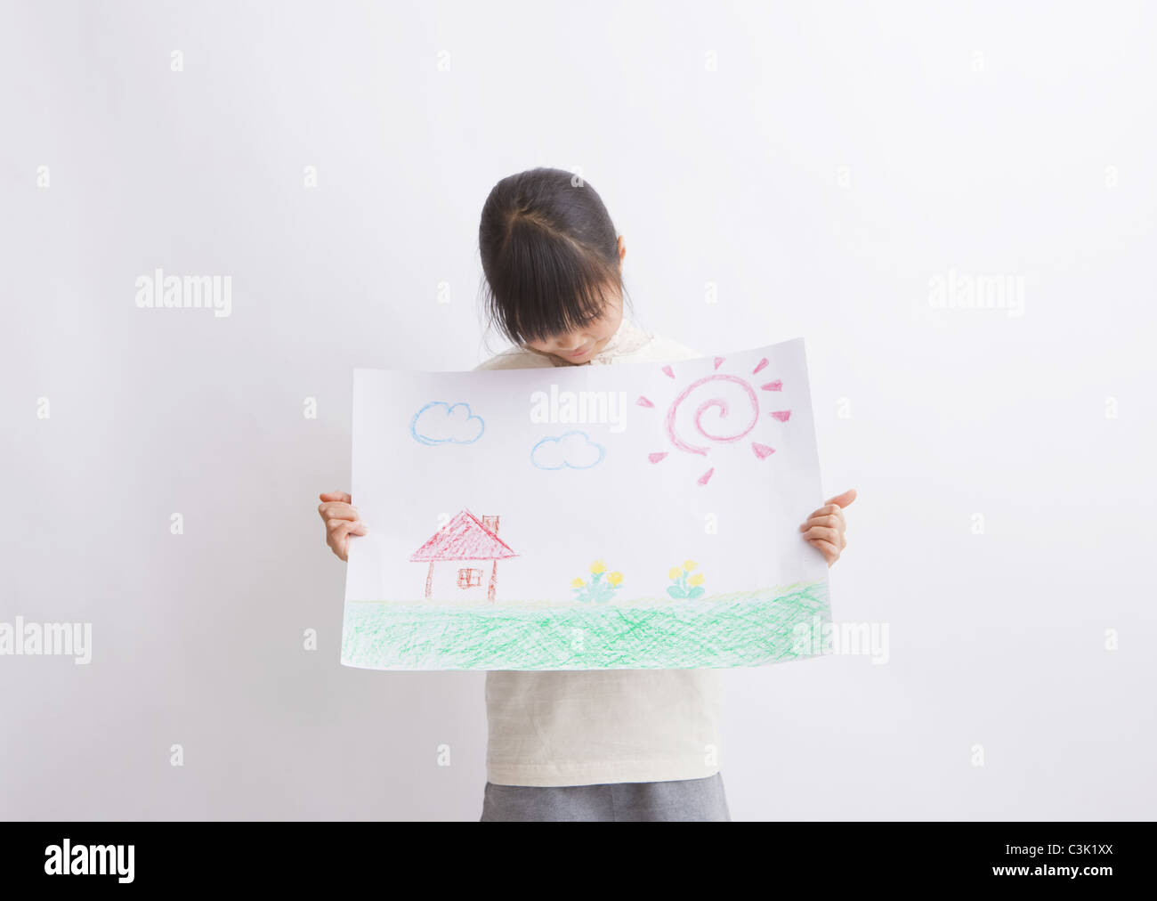 Girl holding drawing Stock Photo - Alamy