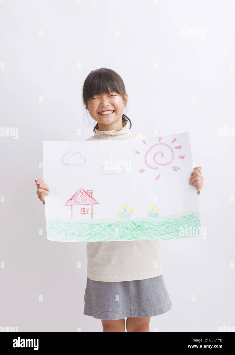 Girl holding drawing Stock Photo - Alamy