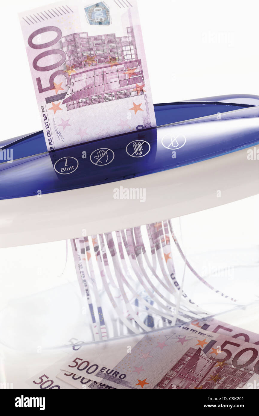 500 euro note shredding through paper shredder Stock Photo - Alamy