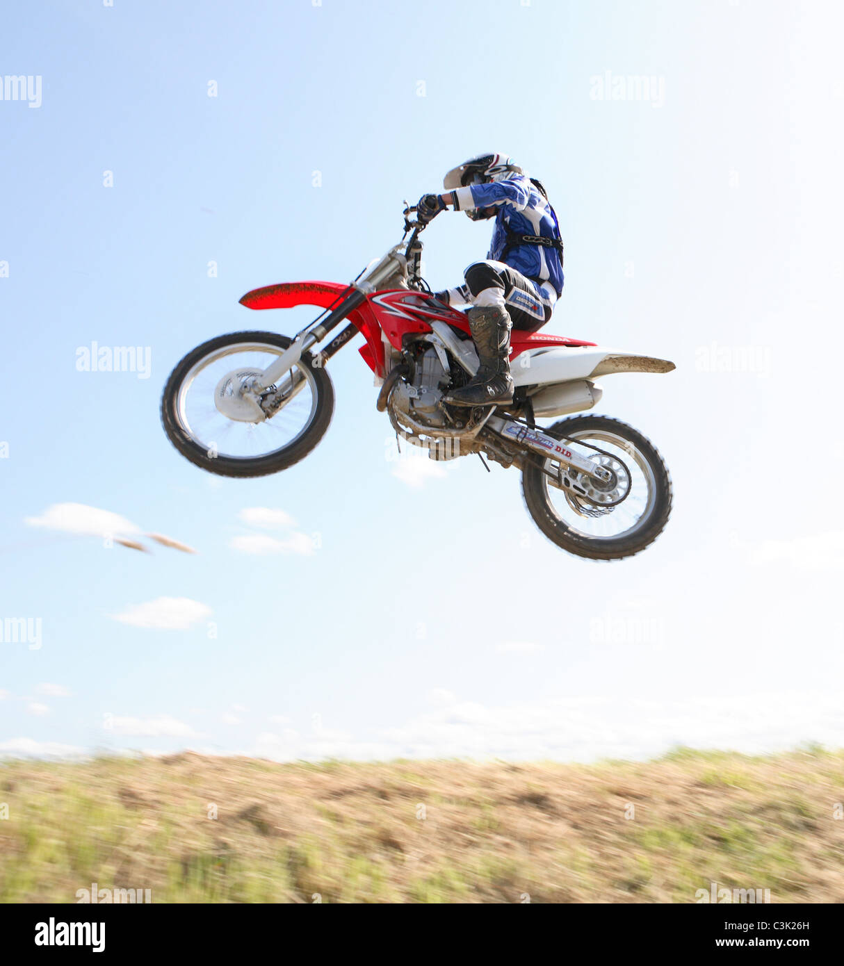 Motocross bike in mid air Stock Photo - Alamy
