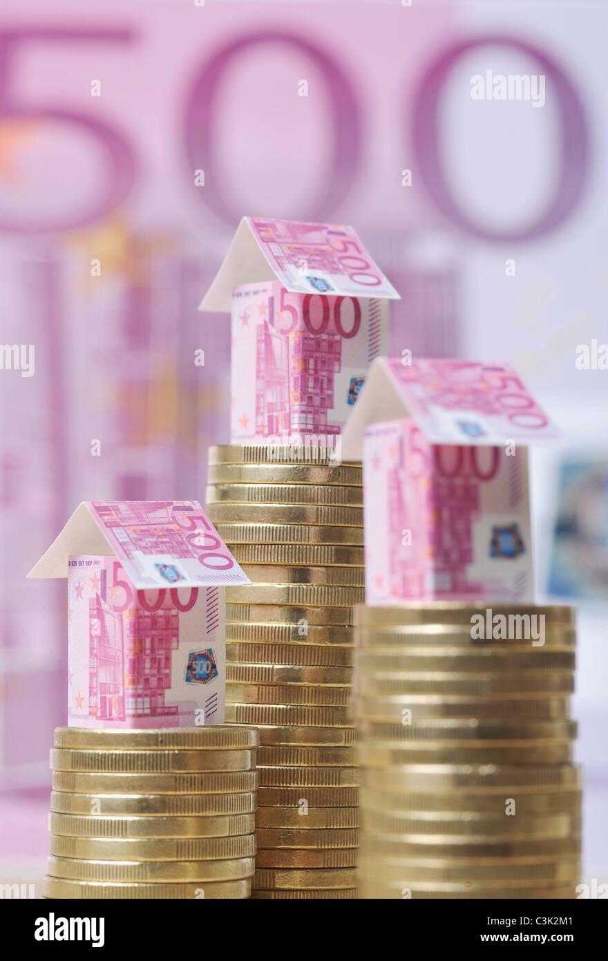 Building of 500 euro notes on stack of coins Stock Photo - Alamy