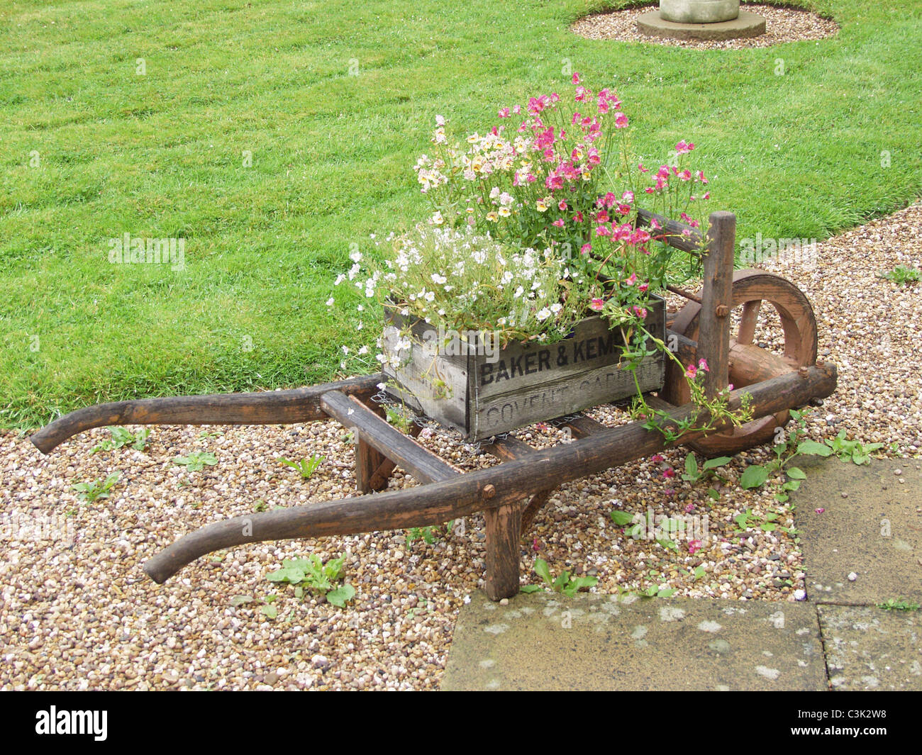 Floral wheel barrow Stock Photo - Alamy
