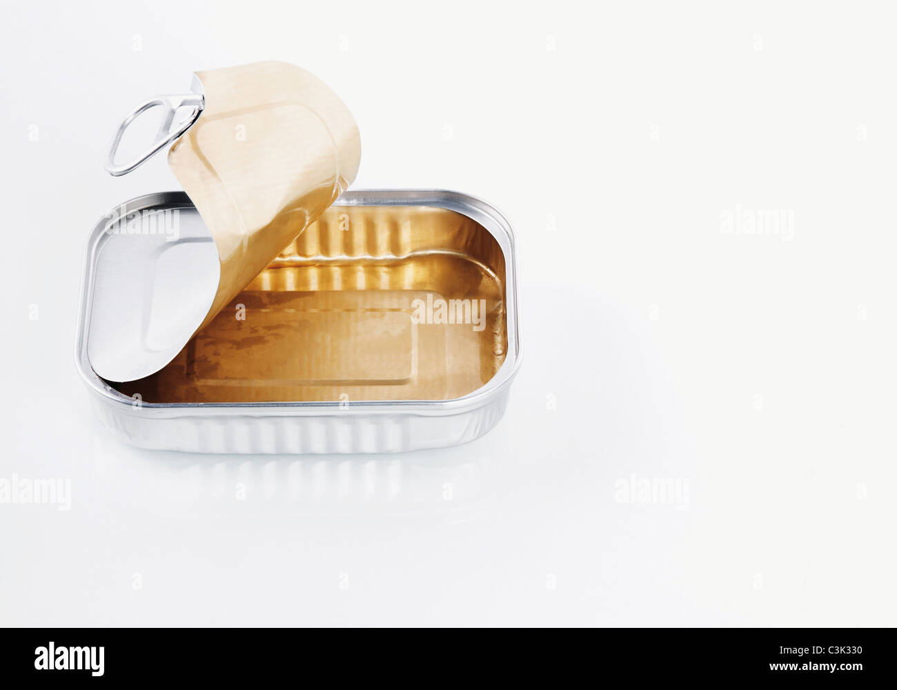 Empty sardine can on white background Stock Photo - Alamy