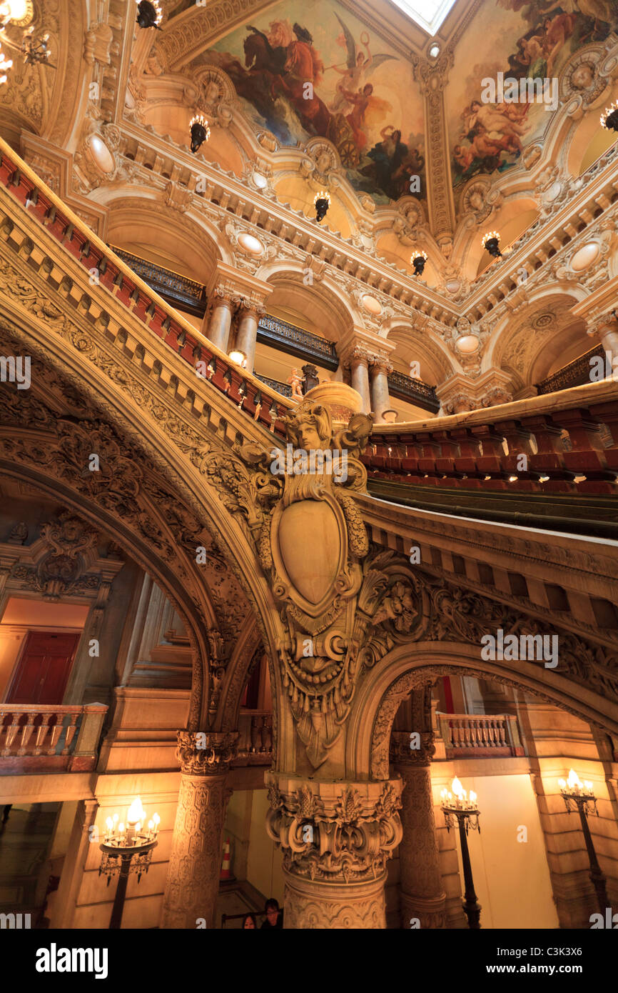 The ornate decoration of the Grand Staircase of the Opera Garnier ...