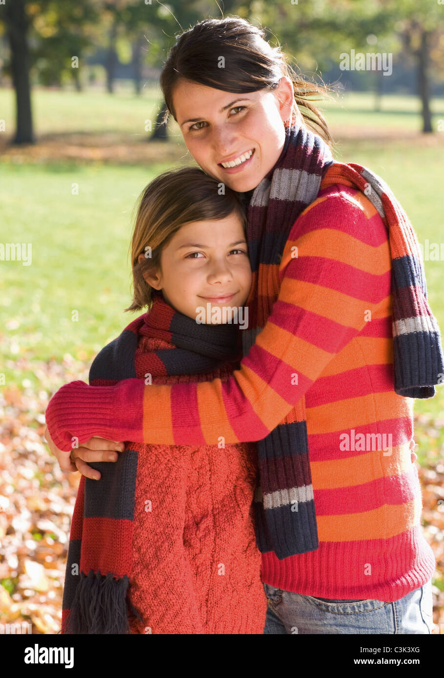 Germany, Nuremberg, Mother embracing daughter, smiling, Portrait Stock ...