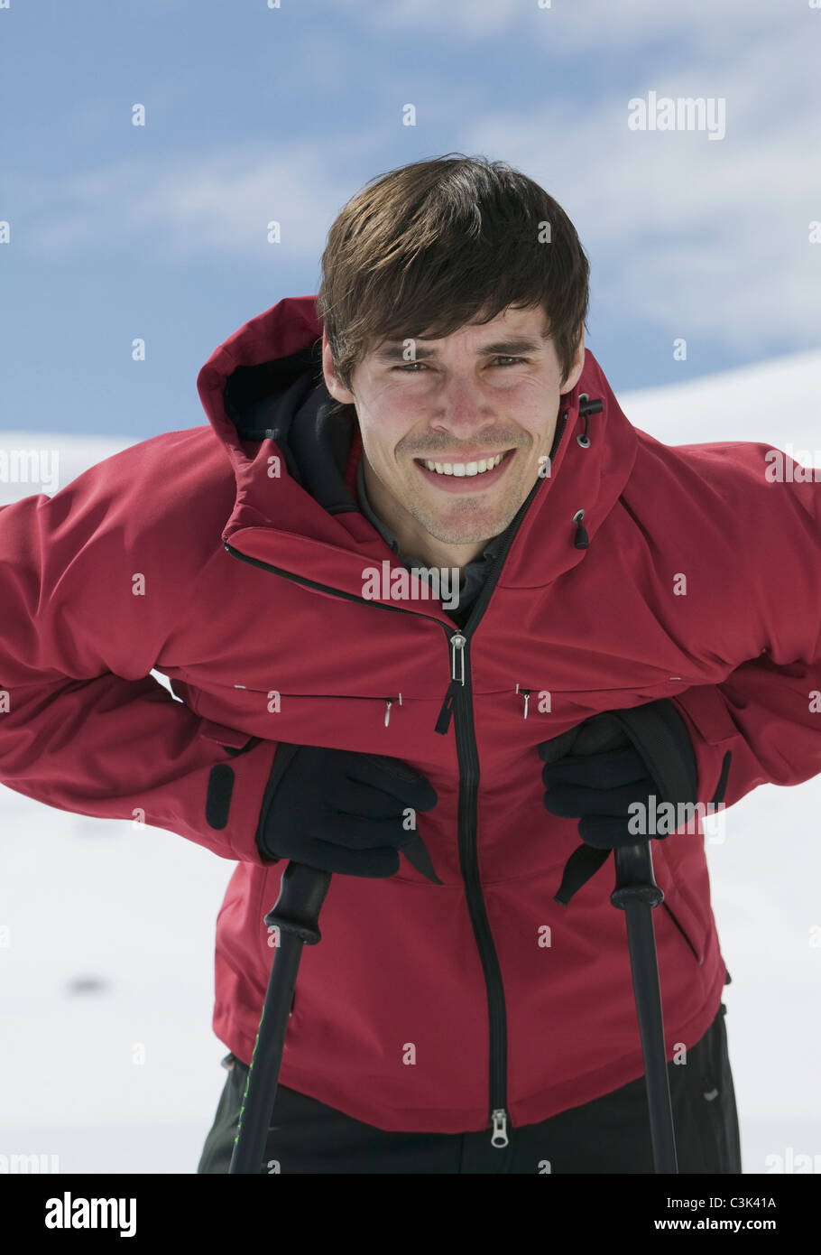 Austria, Tirol, Young man skiing, portrait, smiling Stock Photo - Alamy