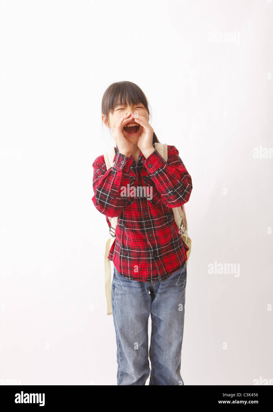 Girl shouting into distance Stock Photo - Alamy