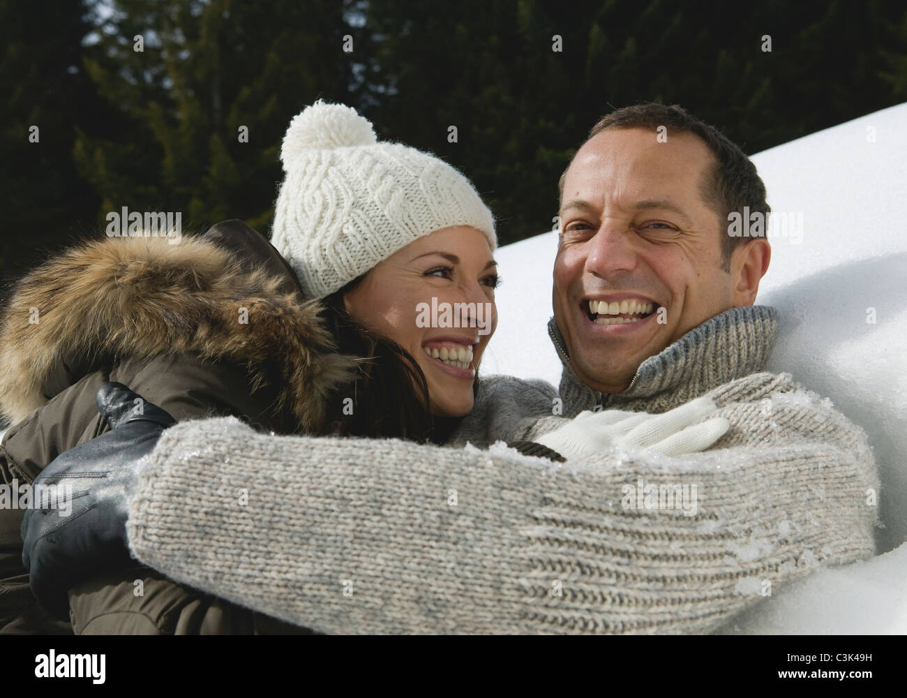 Germany, Bavaria, Couple having fun in snow, laughing Stock Photo - Alamy