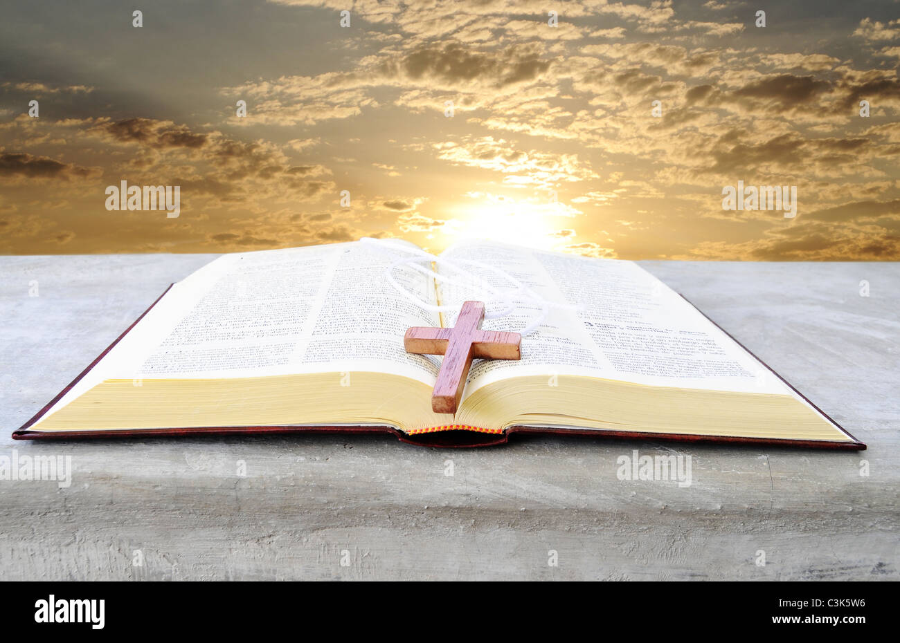 Holy bible over a pulpit with a bright sunrise as background Stock ...