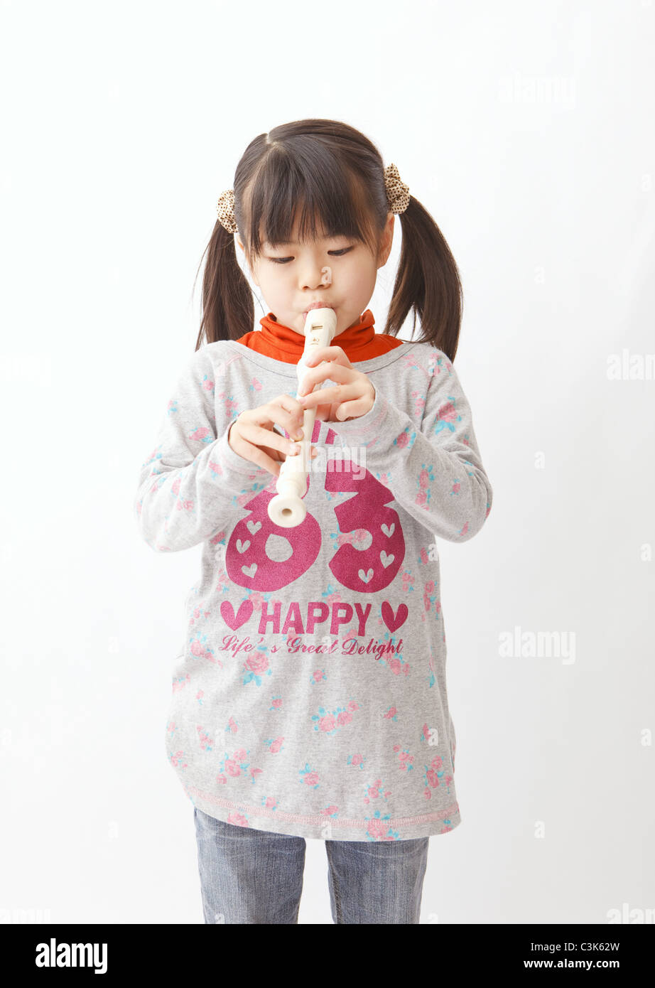 Girl playing recorder Stock Photo - Alamy