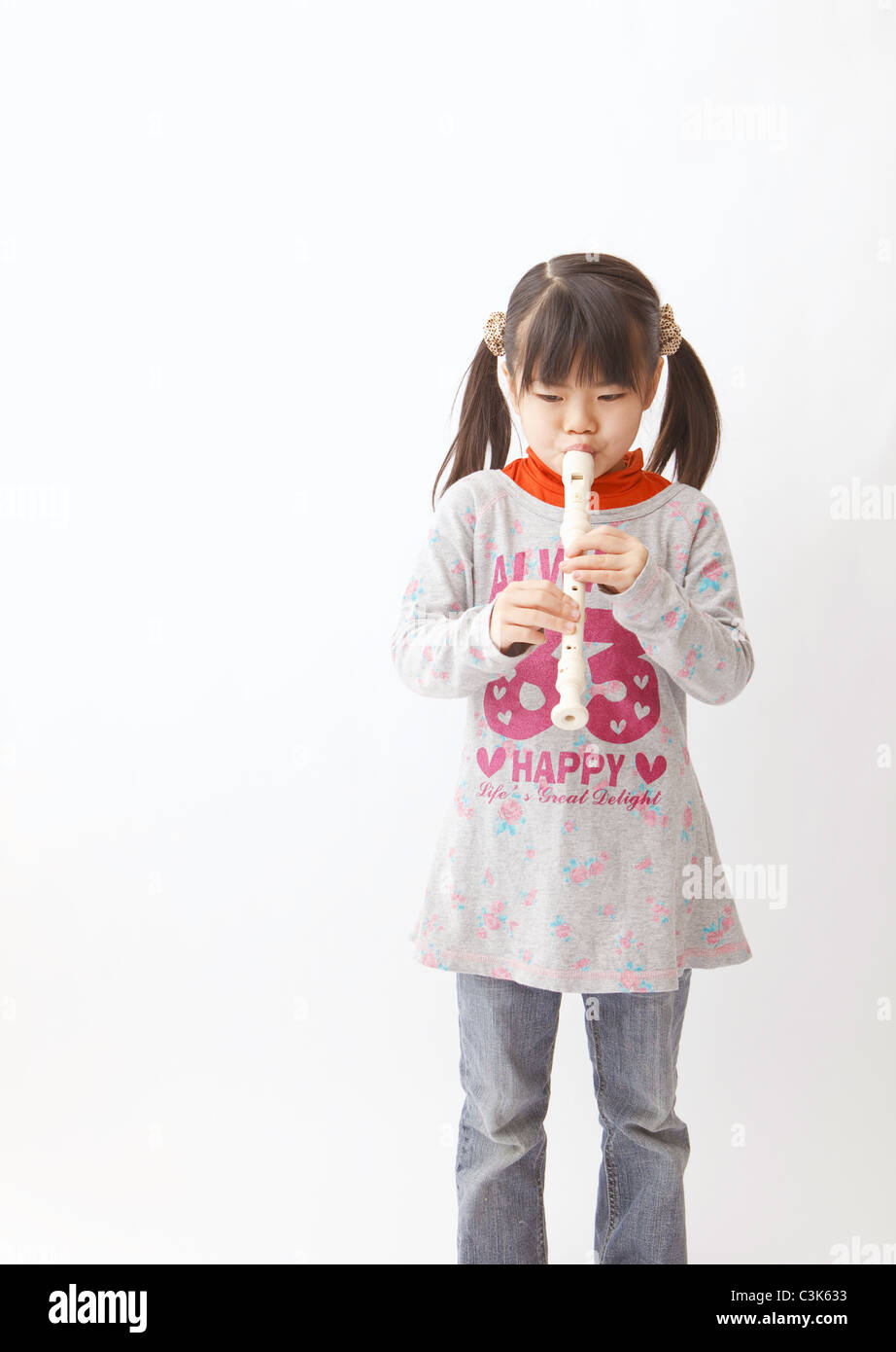 Girl playing recorder Stock Photo - Alamy
