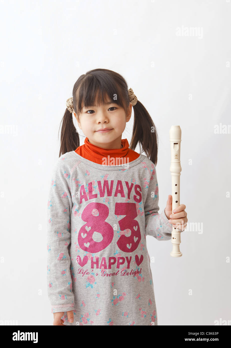 Girl holding recorder Stock Photo - Alamy