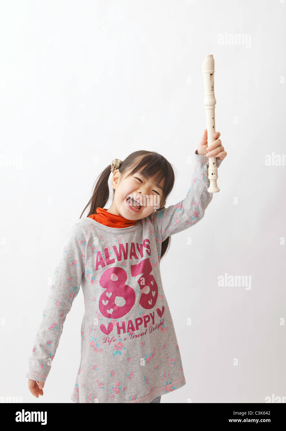 Girl holding recorder Stock Photo - Alamy
