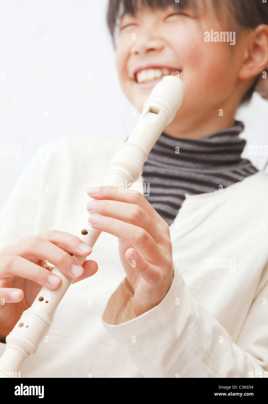 Girl holding recorder Stock Photo - Alamy