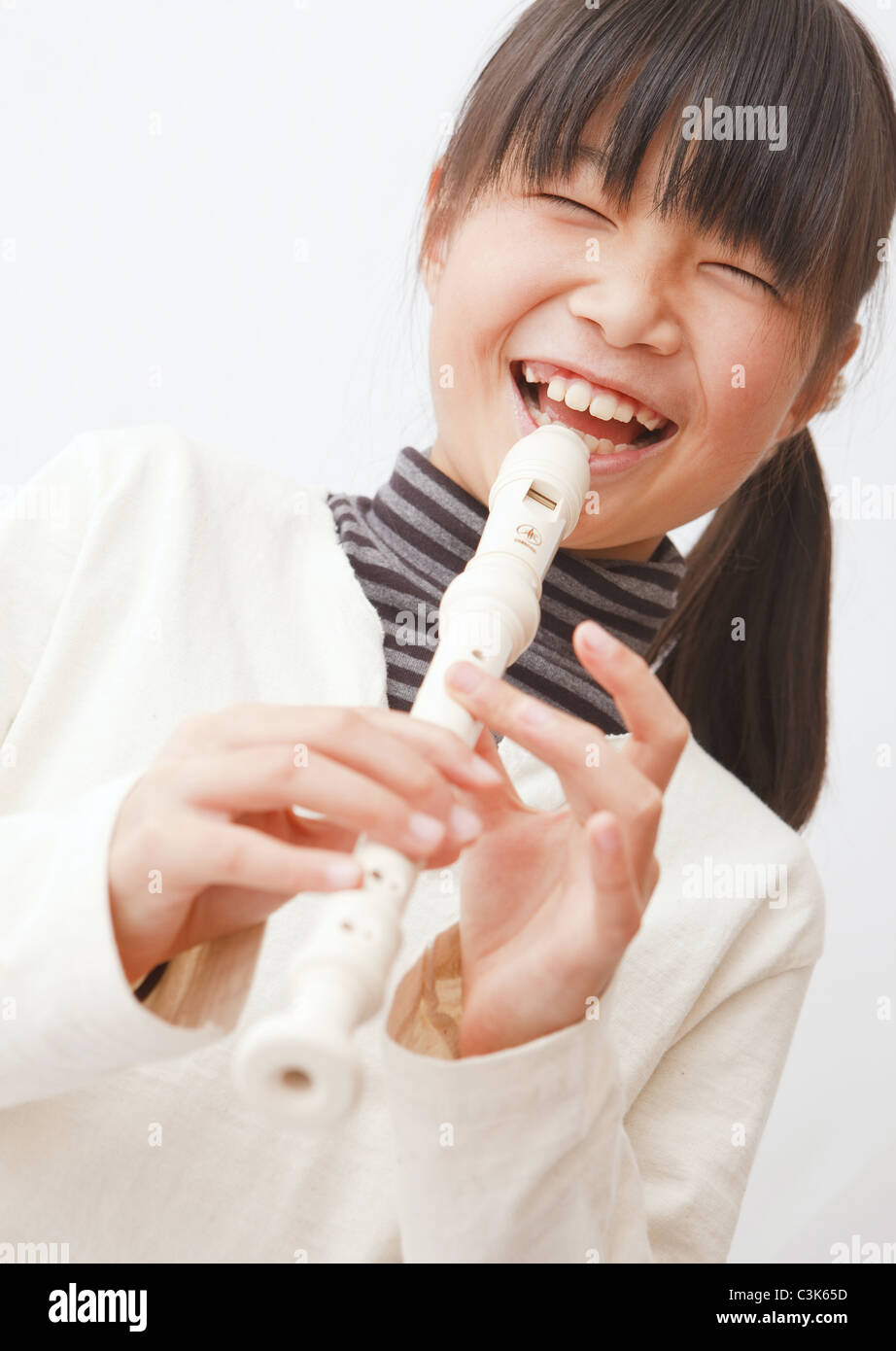 Girl holding recorder Stock Photo - Alamy