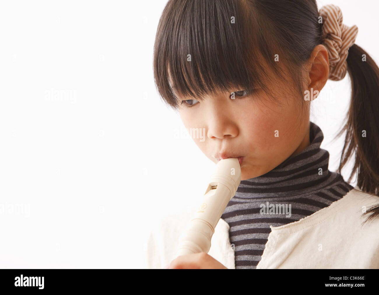Girl playing recorder hi-res stock photography and images - Alamy
