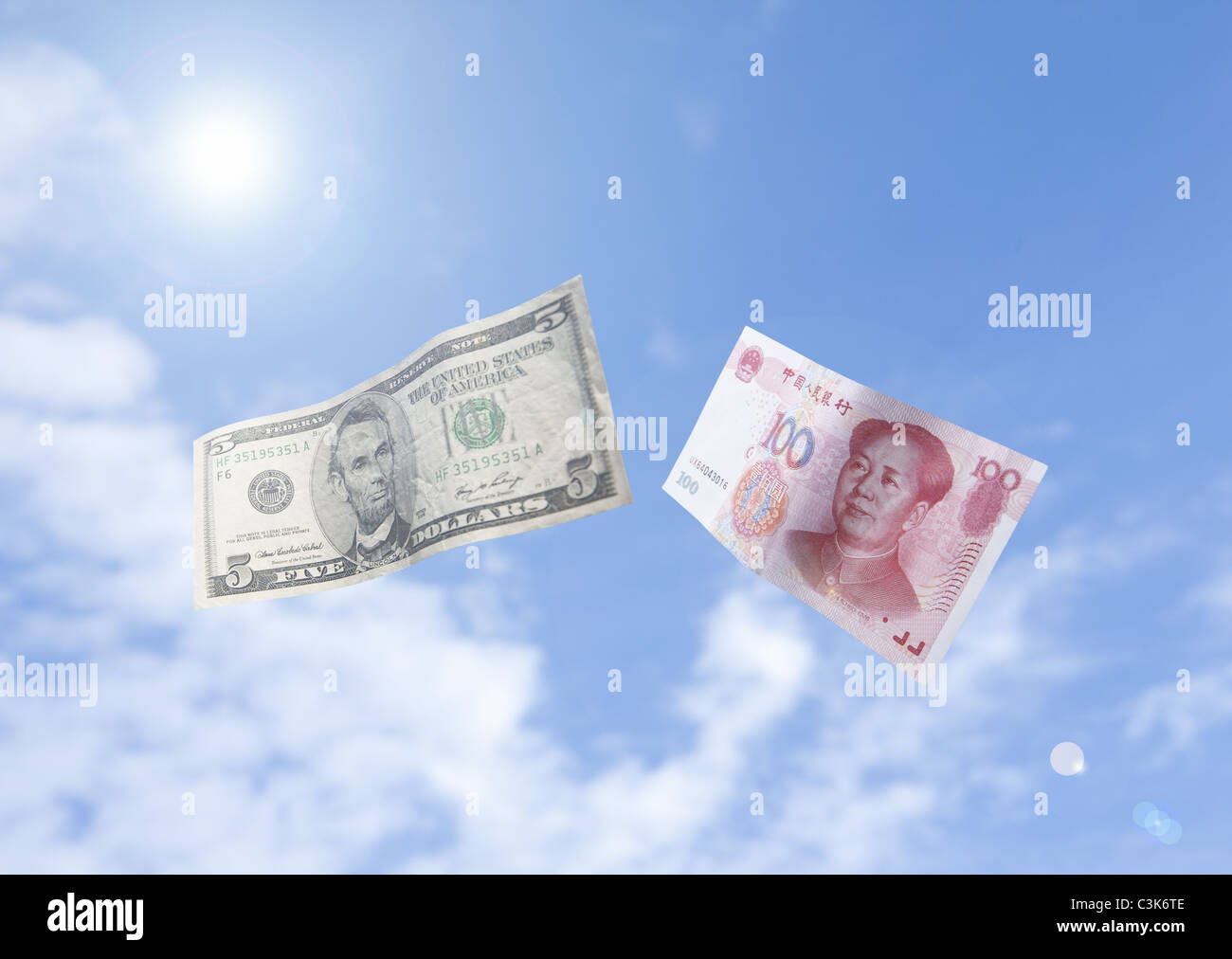 Bills floating in blue sky Stock Photo - Alamy