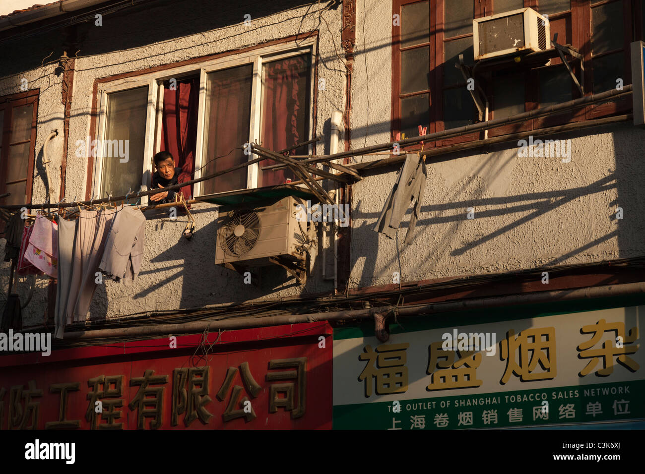 Man smoking out window in hi-res stock photography and images - Alamy