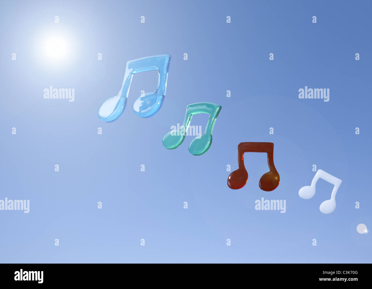 Musical notes floating in blue sky Stock Photo - Alamy