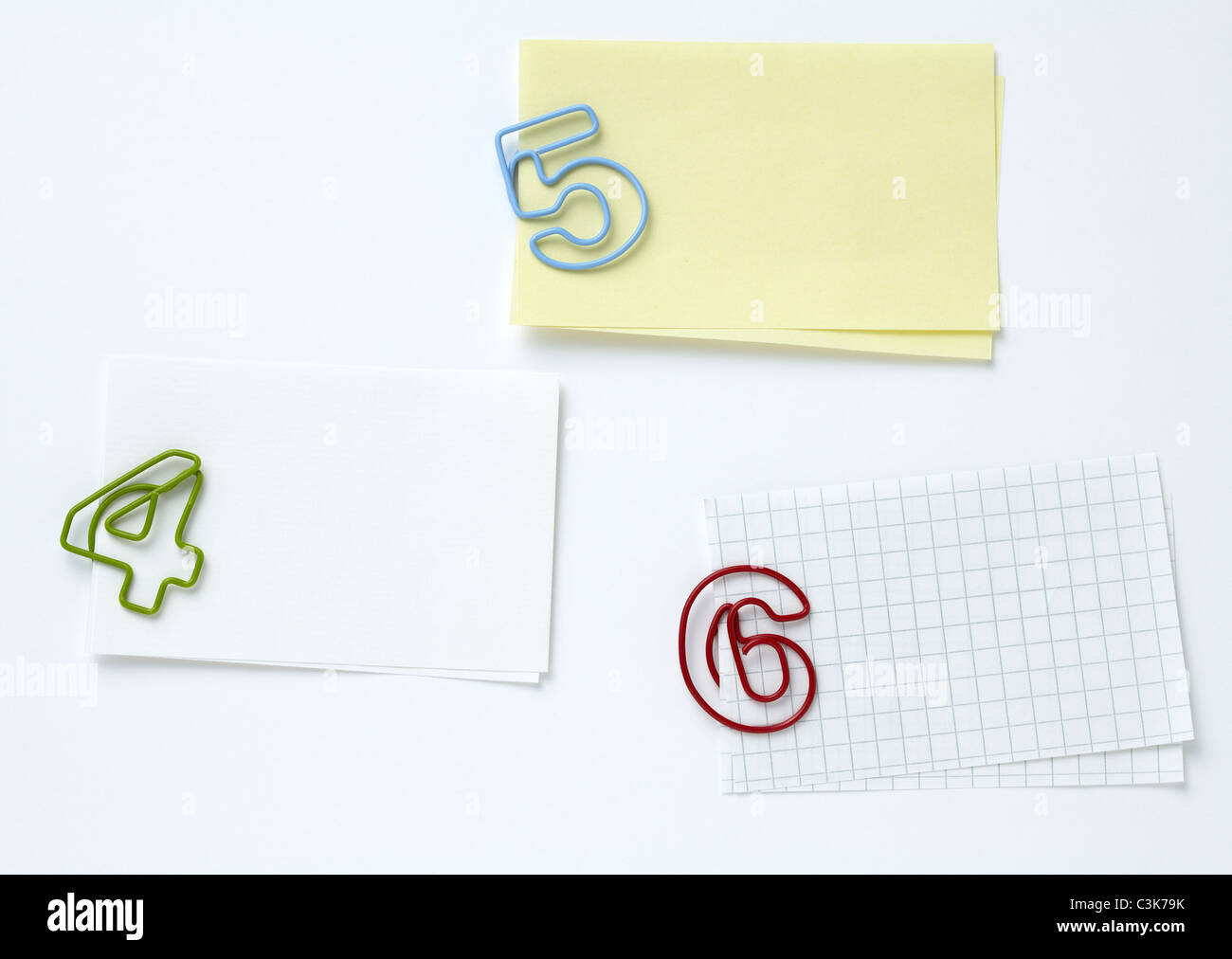 Number shaped clips and memo pads Stock Photo - Alamy
