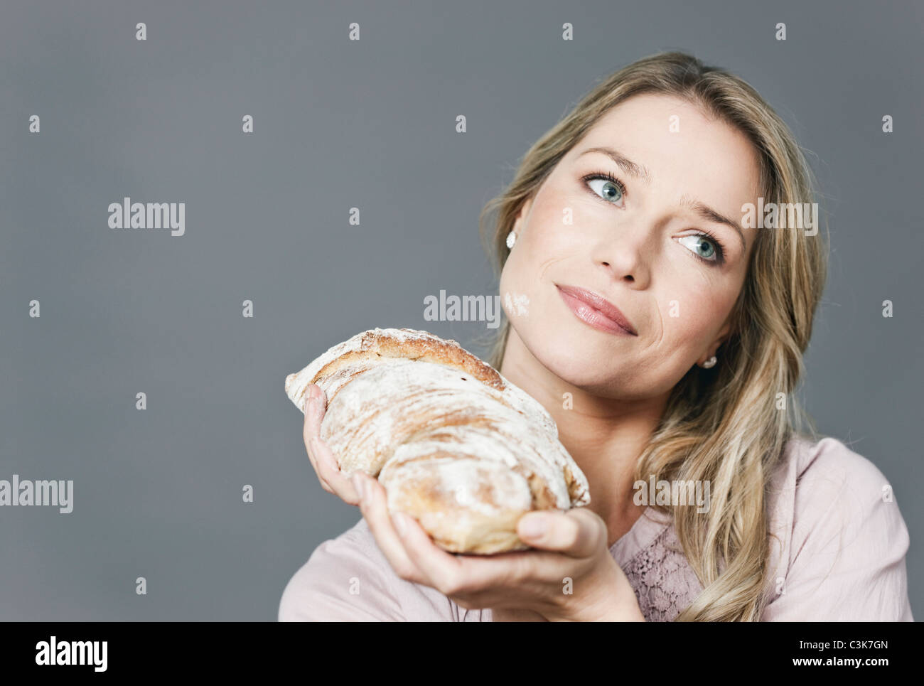 Woman eating bread plain hi-res stock photography and images - Alamy