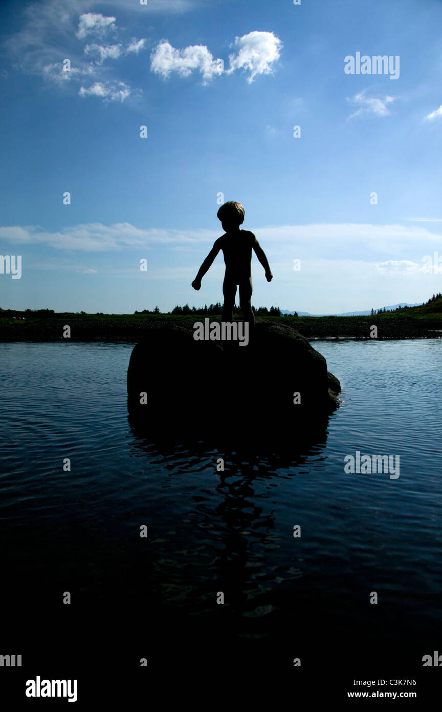boy on rock Stock Photo - Alamy