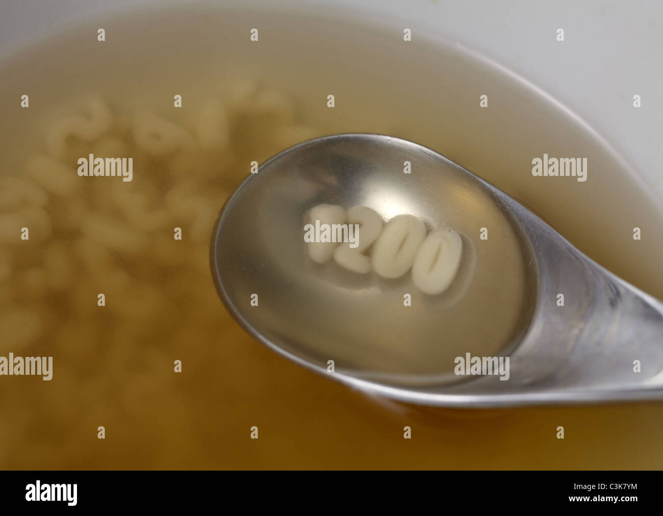 Number shaped macaroni in soup Stock Photo - Alamy