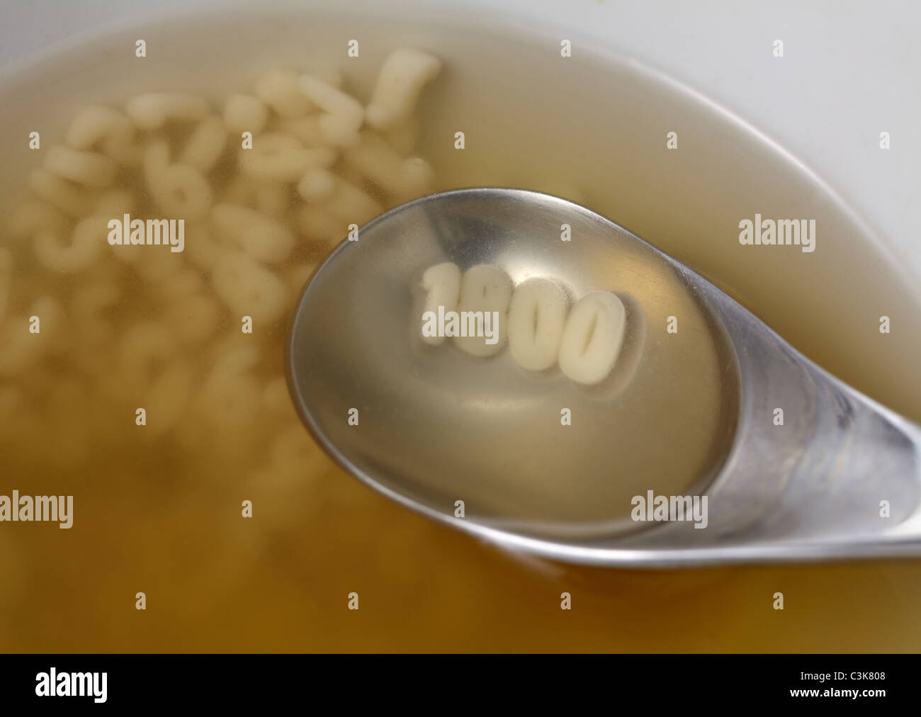 Number shaped macaroni in soup Stock Photo - Alamy